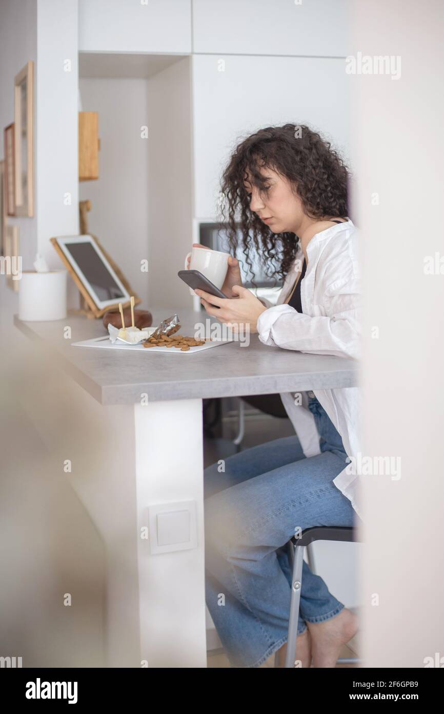 Young domestic feminine typing message texting communicate social ...