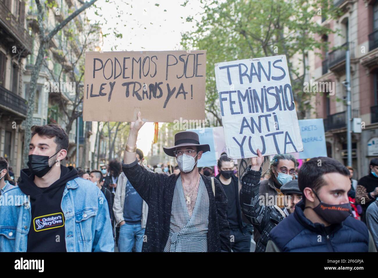 Protesters hold placards during the demonstration. On the International ...