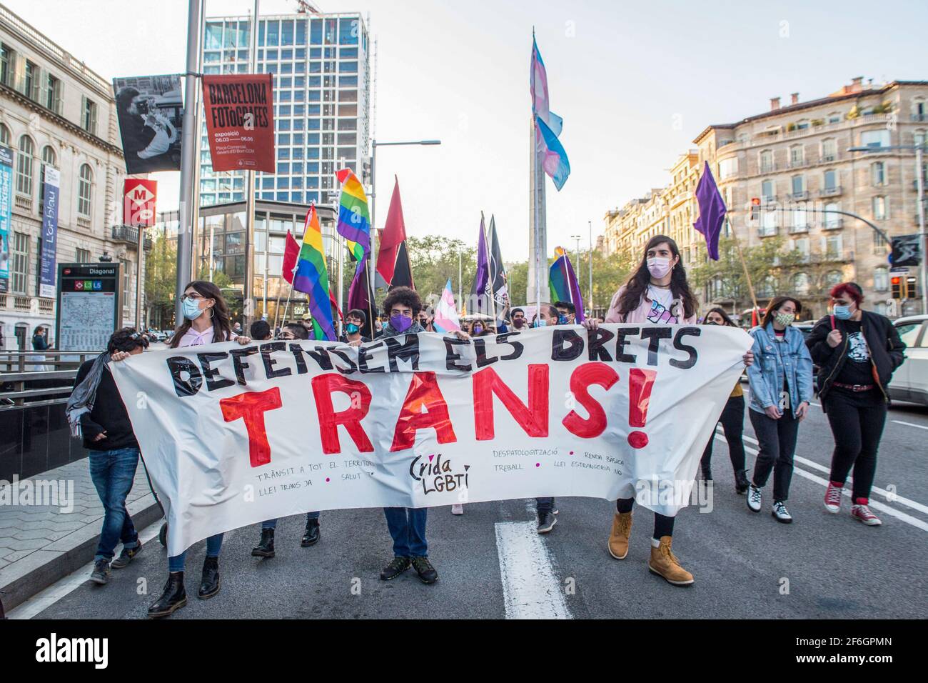 Protesters hold a banner that says We defend trans rights during the ...