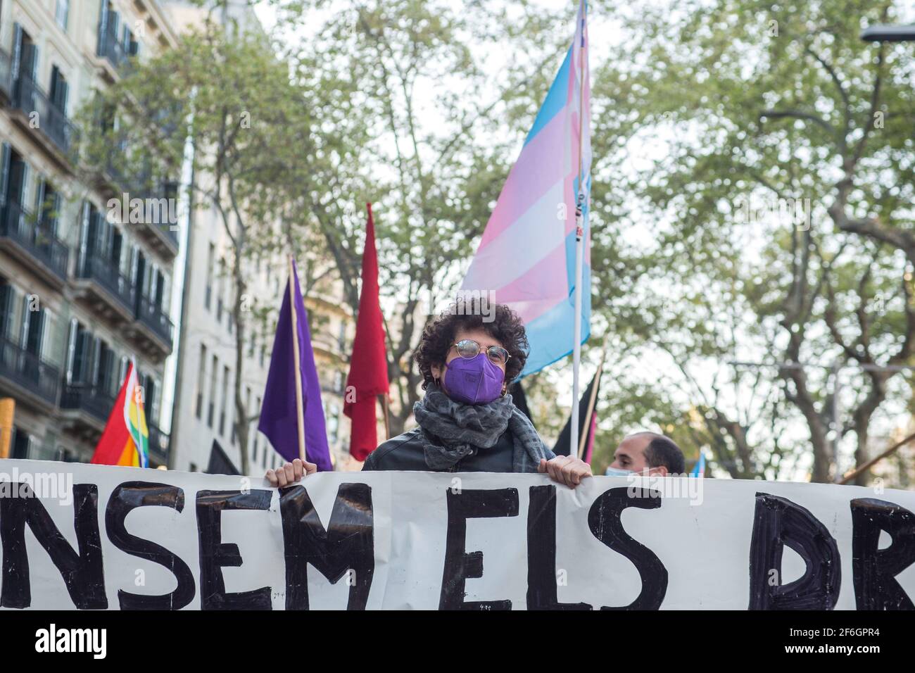 A protester holds a banner during the demonstration. On the ...