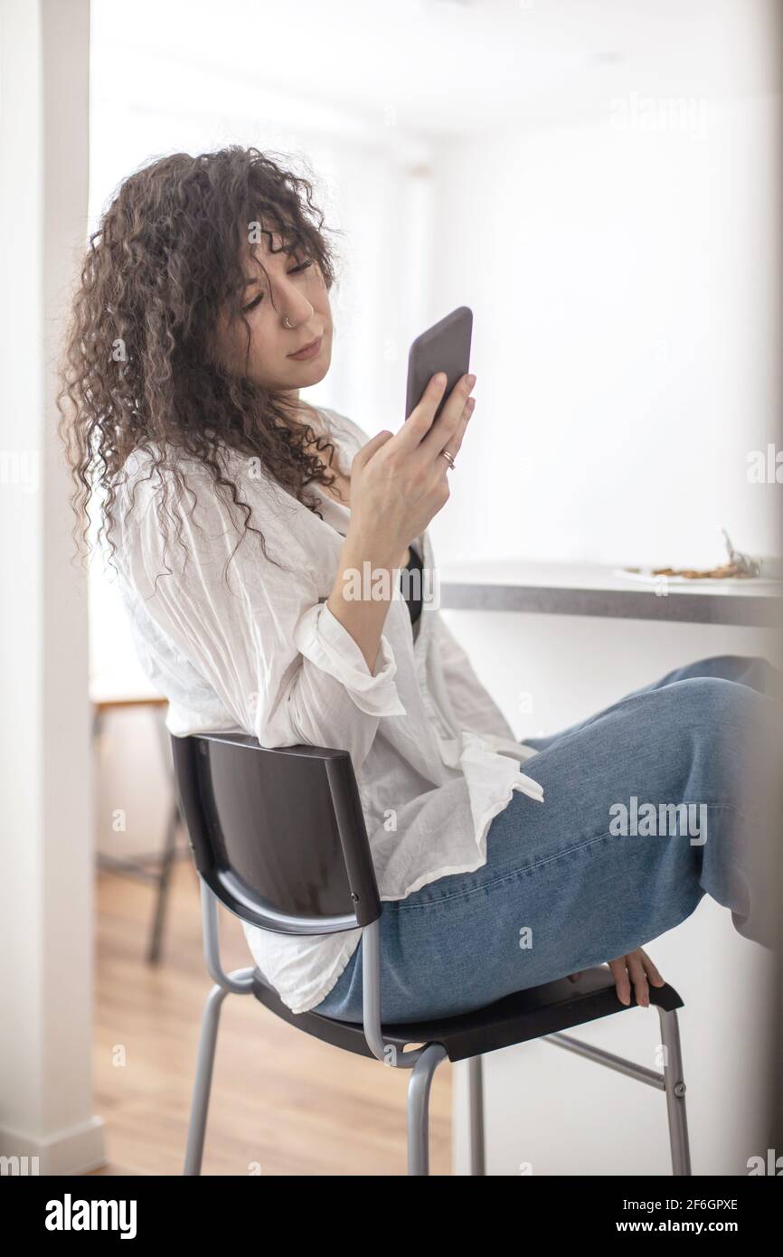 Young domestic feminine typing message texting communicate social ...
