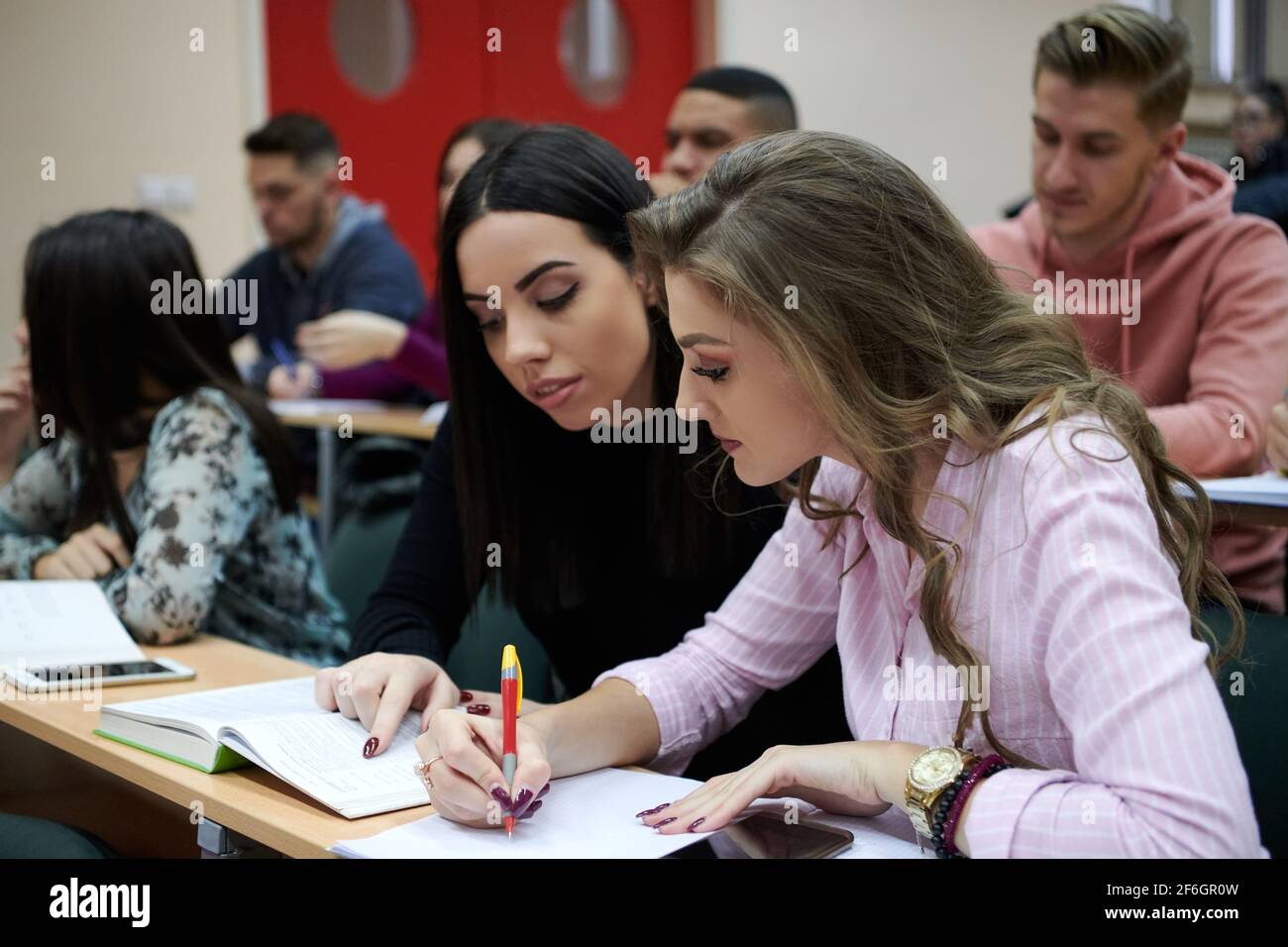 In the Classroom Multi Ethnic Students Listening to a Lecturer and ...