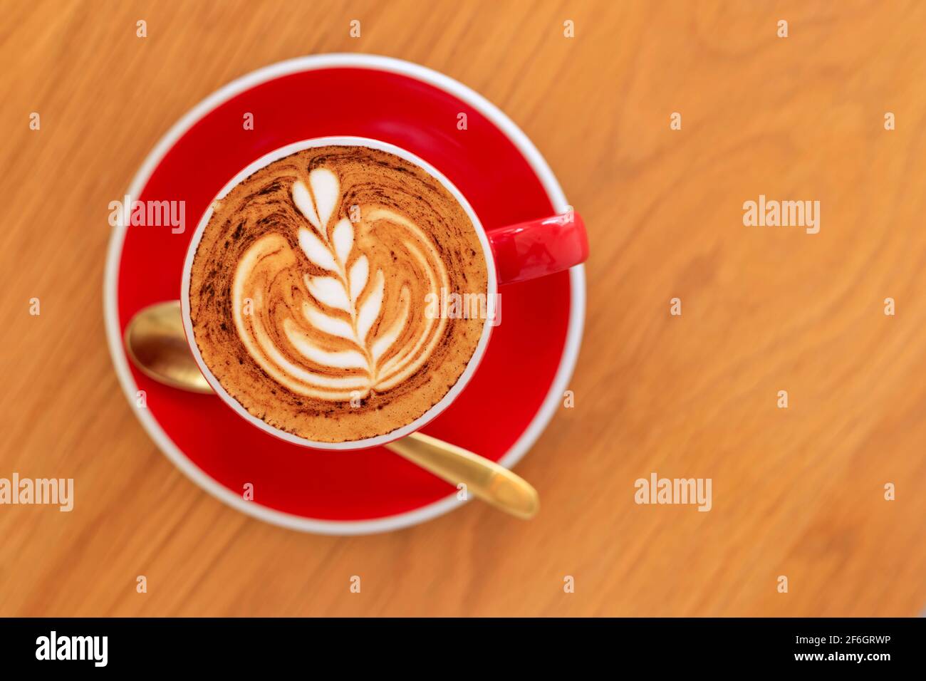 Soft focus Top view close up of hot espresso, latte coffee in a red ...