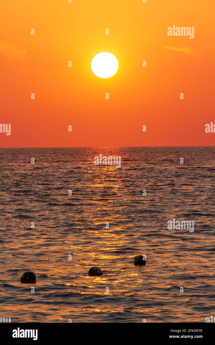 Beautiful sunset over the clam sea with cloud sky background. Sunset ...