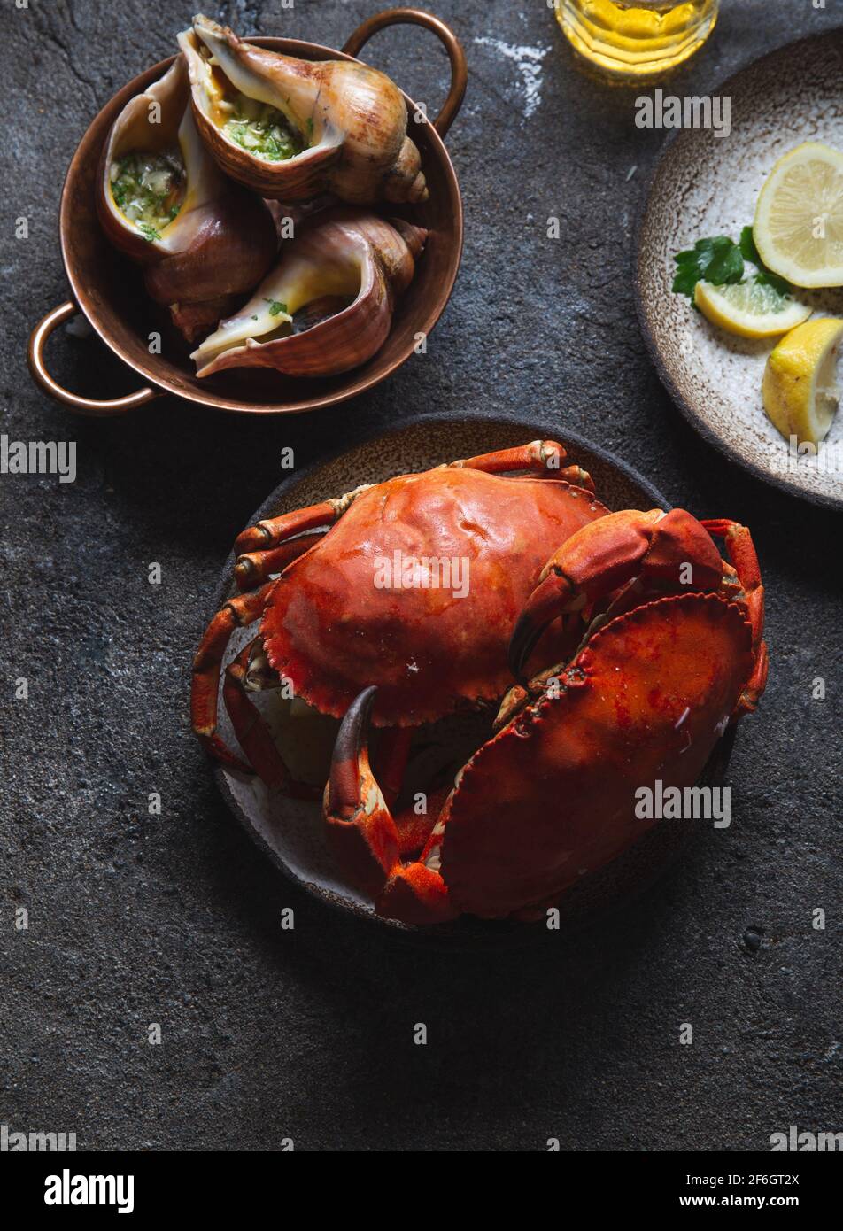 Fresh seafood shellfish mussels, clams, crabs and snails on gray ...