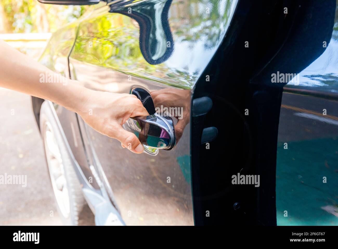 Hand on handle hi-res stock photography and images - Alamy