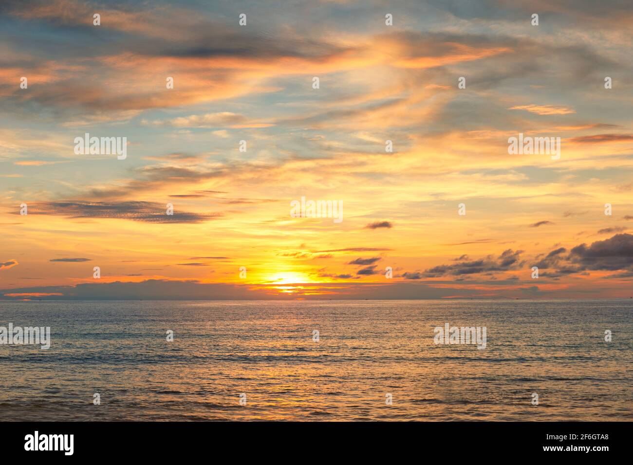 Beautiful sunset over the clam sea with cloud and sky background ...