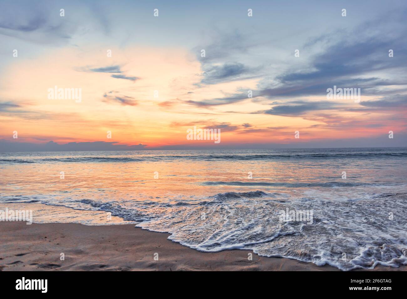 Beautiful sunset over the clam sea with cloud and sky background ...