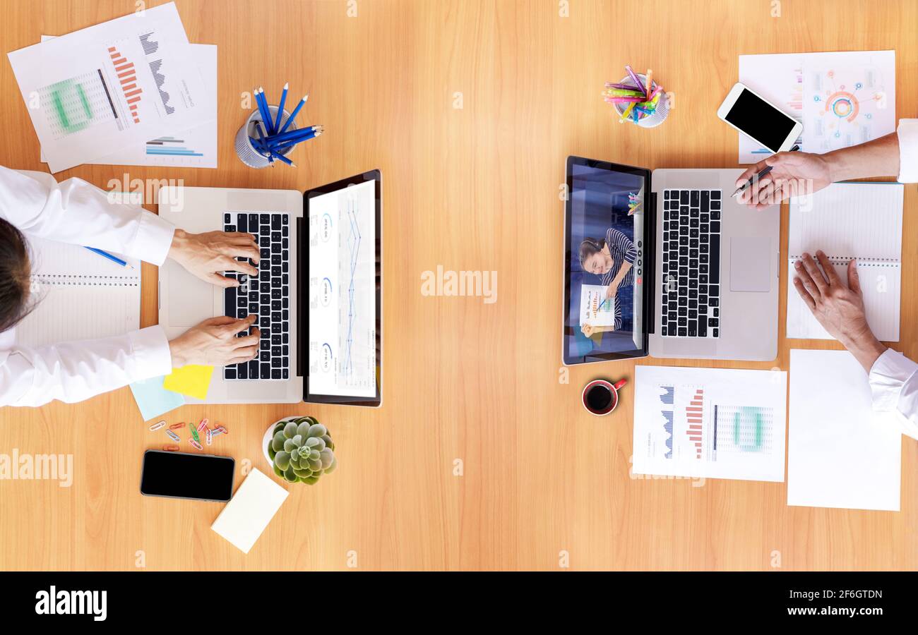 Top view Businessman and businesswoman analysis financial chart with ...