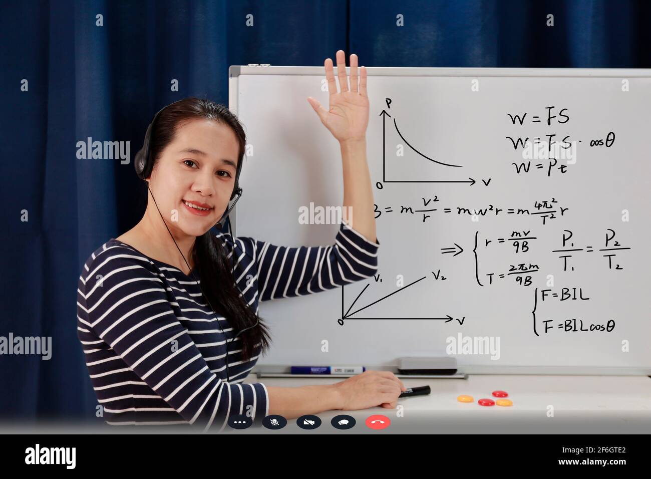Asian school woman teacher working from home teach online math to ...