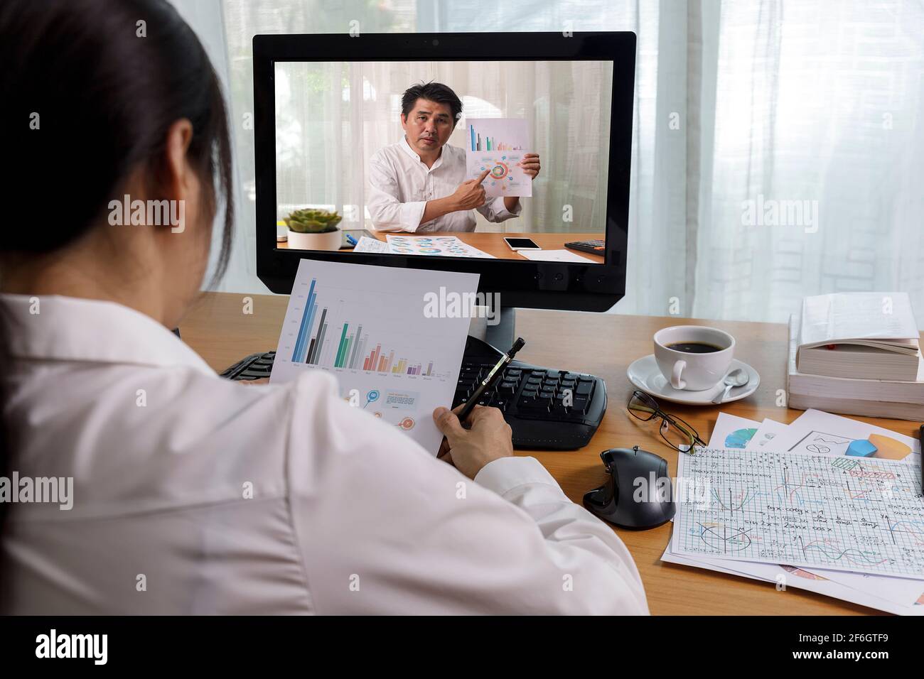 Business long distance video call, businessman and businesswoman ...