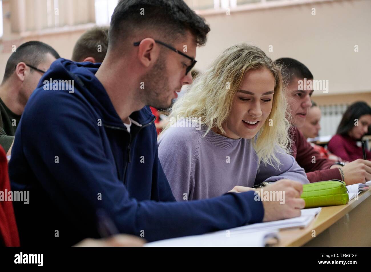 In the Classroom Multi Ethnic Students Listening to a Lecturer and ...