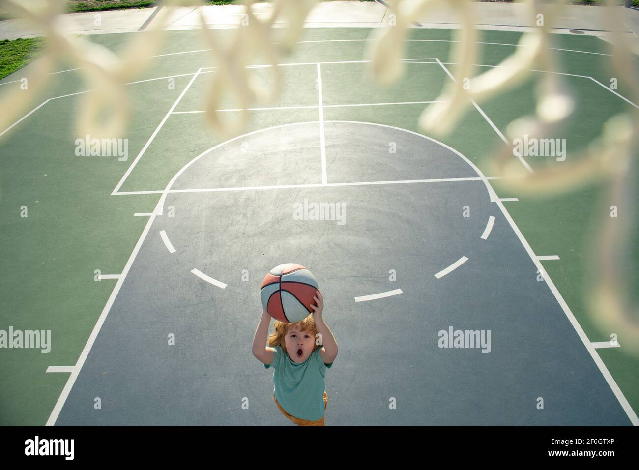 Basketball kids game. Cute little child boy holding a basket ball ...