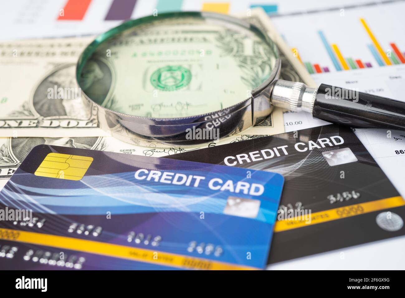 Credit card model with Magnifying glass, Financial development ...