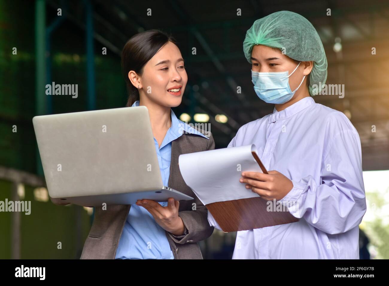 Asian women smiling use laptop explain employee , Manager computer ...