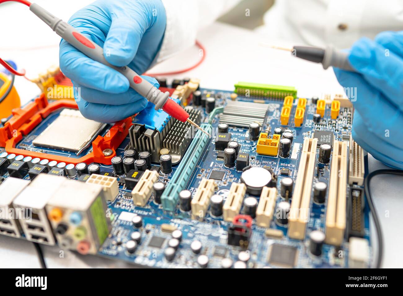 Technician repairing micro circuit main board computer electronic ...