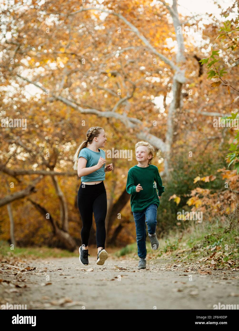 Two boys running in forest hi-res stock photography and images - Alamy