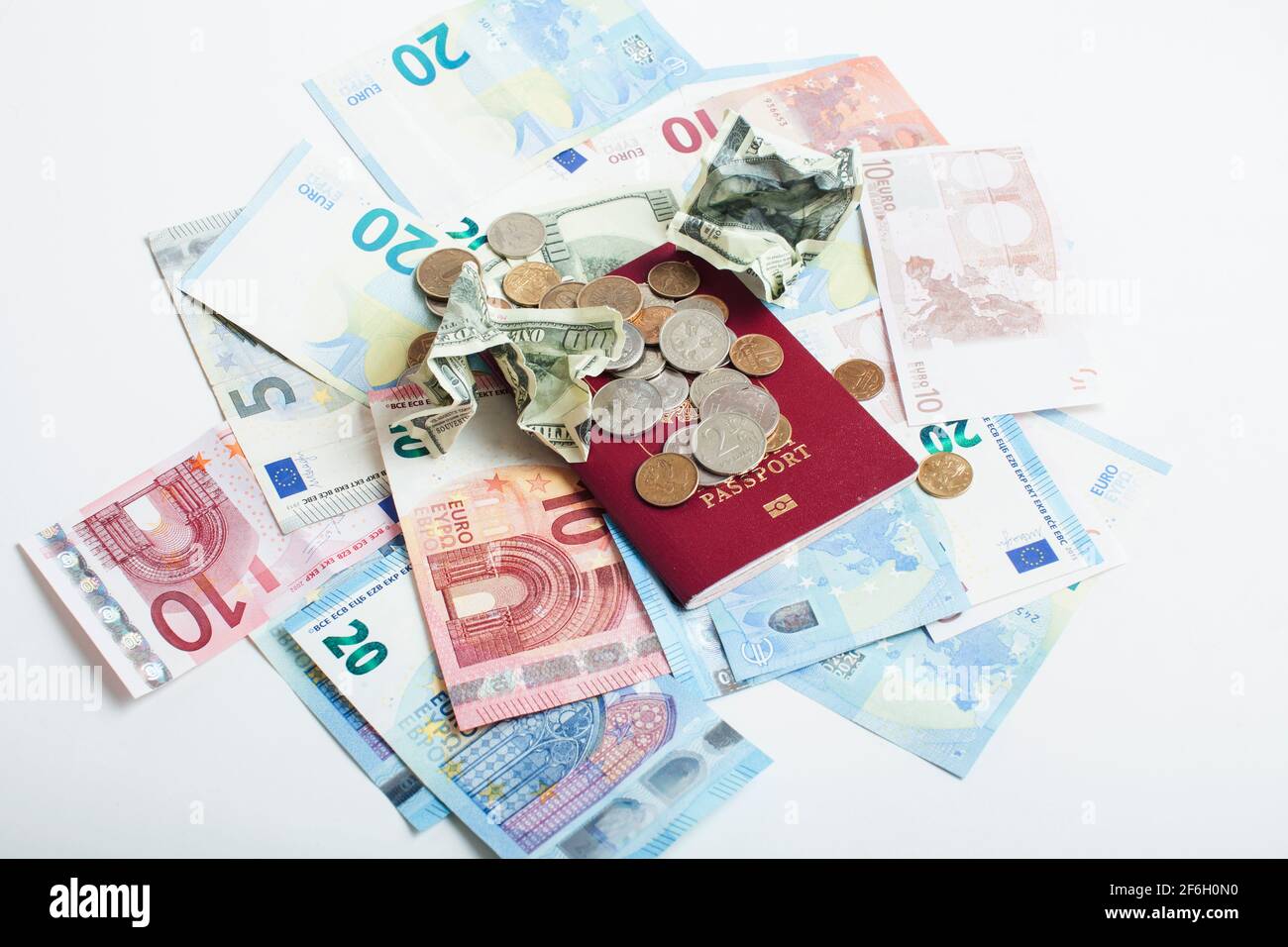 Cash on table isolated: dollars, euro, rubl broken money. All in mess ...