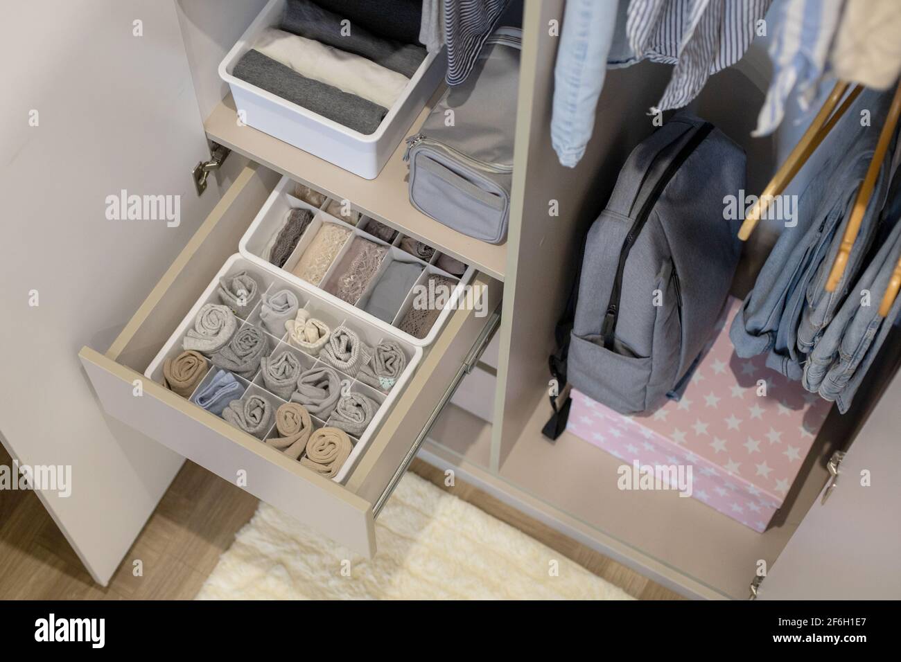Wardrobe with perfect order clothes shades Stock Photo - Alamy