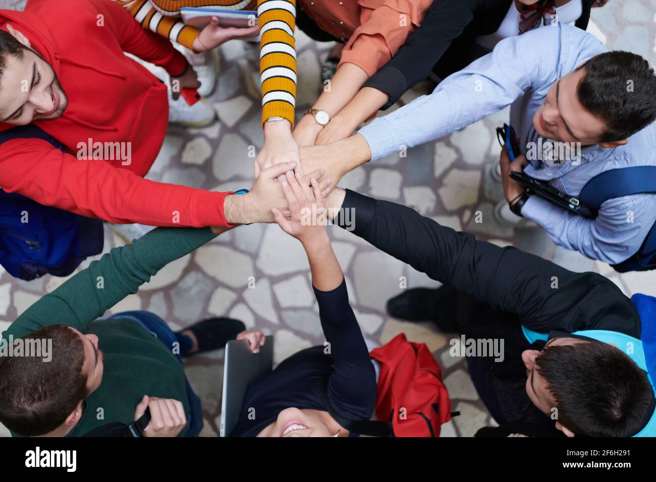 Smiling students hands on top hi-res stock photography and images - Alamy