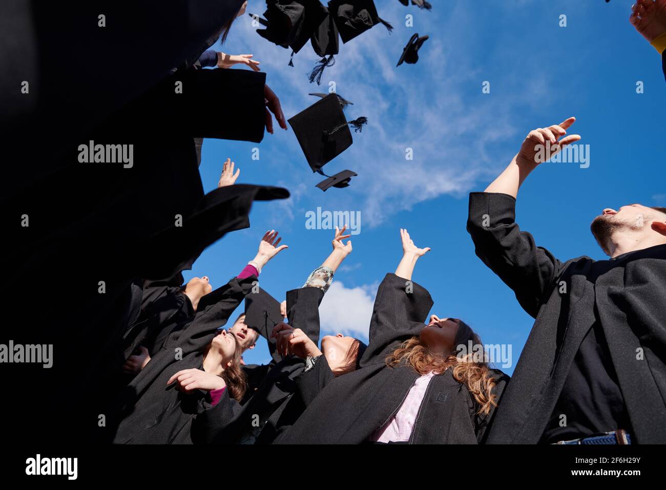 Congratulations Low angle view of happy group of six young cheerful ...
