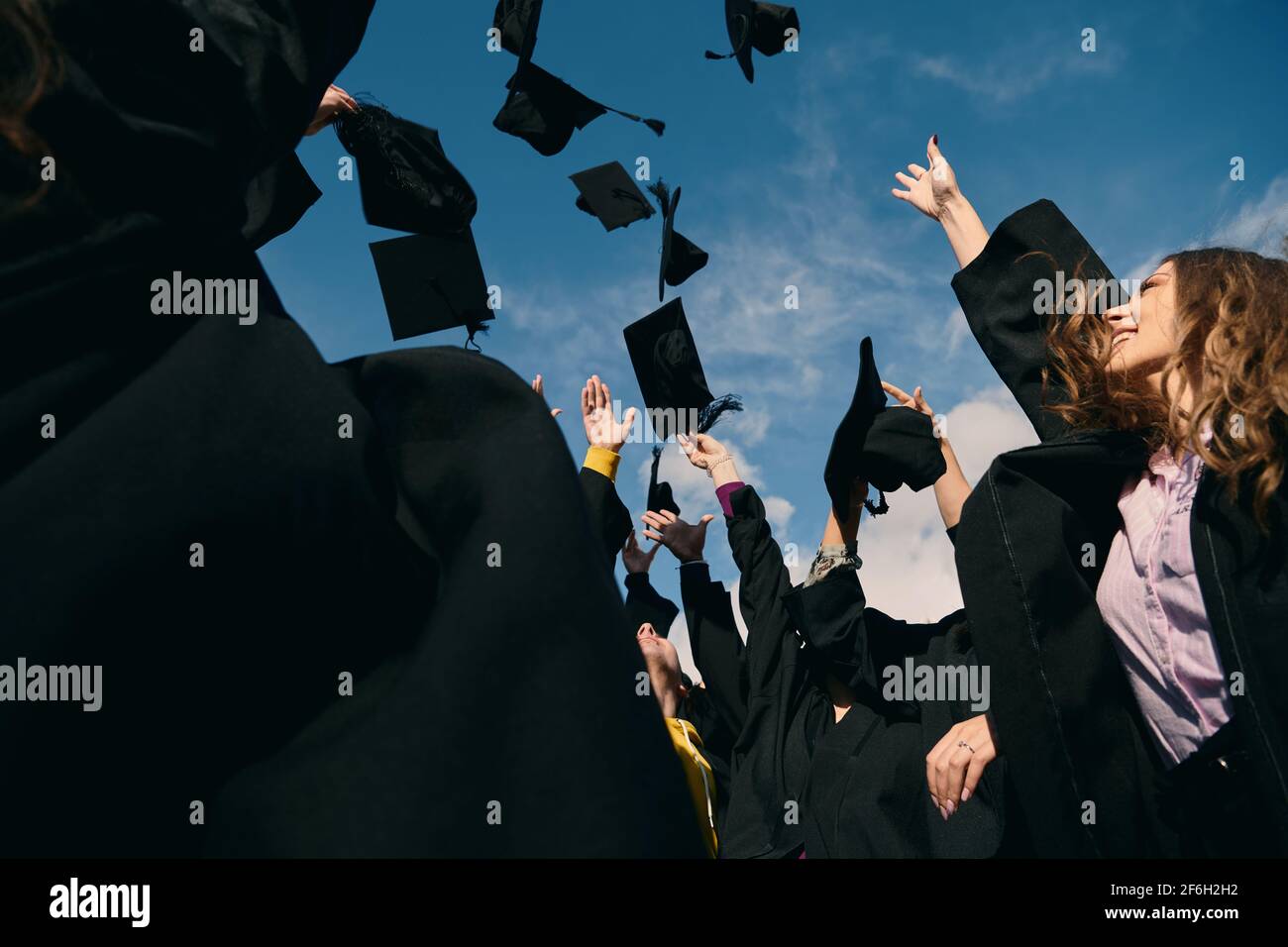 Congratulations Low angle view of happy group of six young cheerful ...