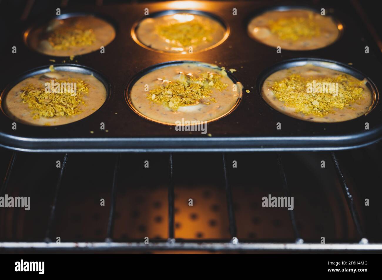 vegan savoury muffins with olives and nutritional yeast in baking tray ...