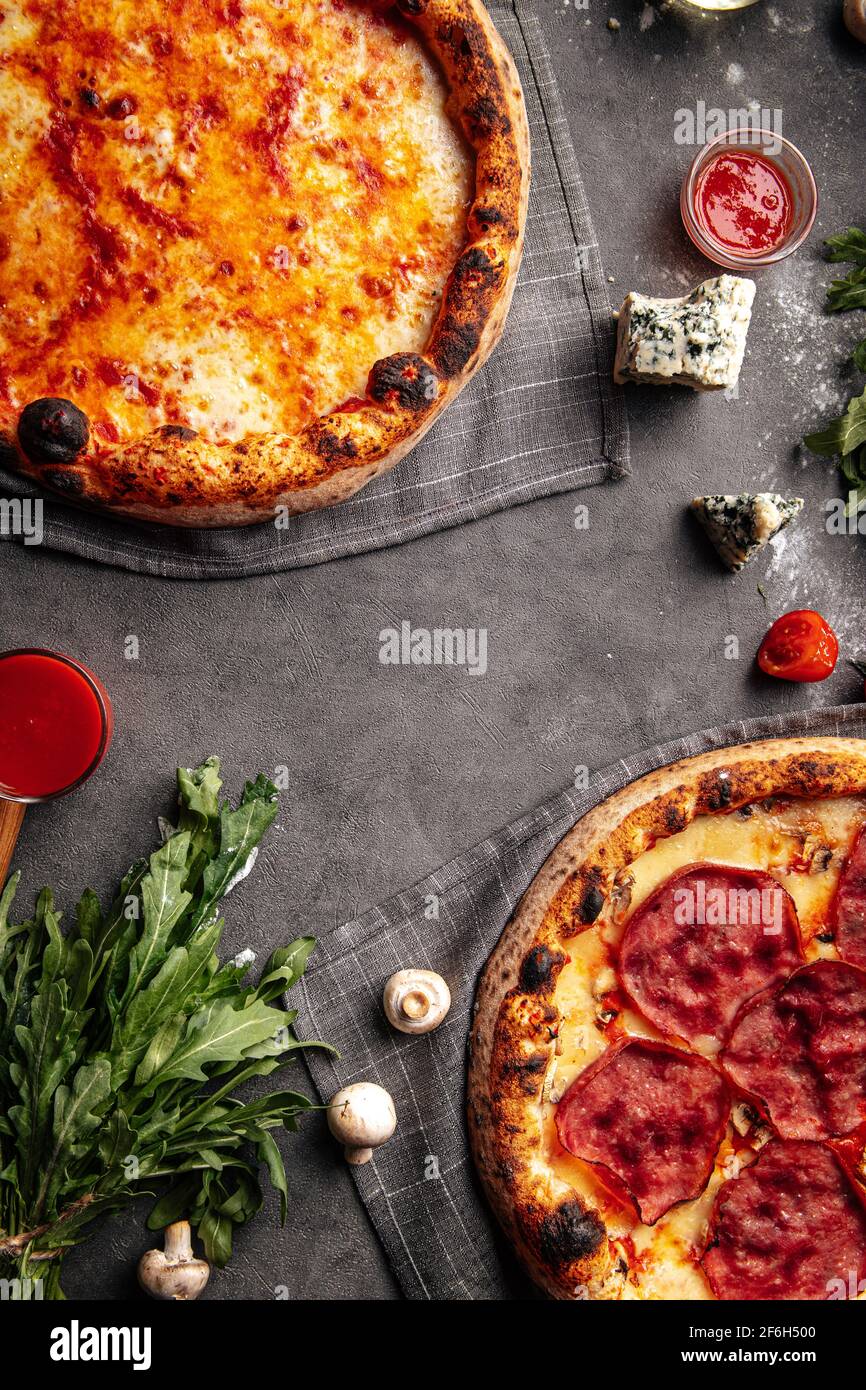 Top view on fresh baked neopolitan pizzas Stock Photo - Alamy