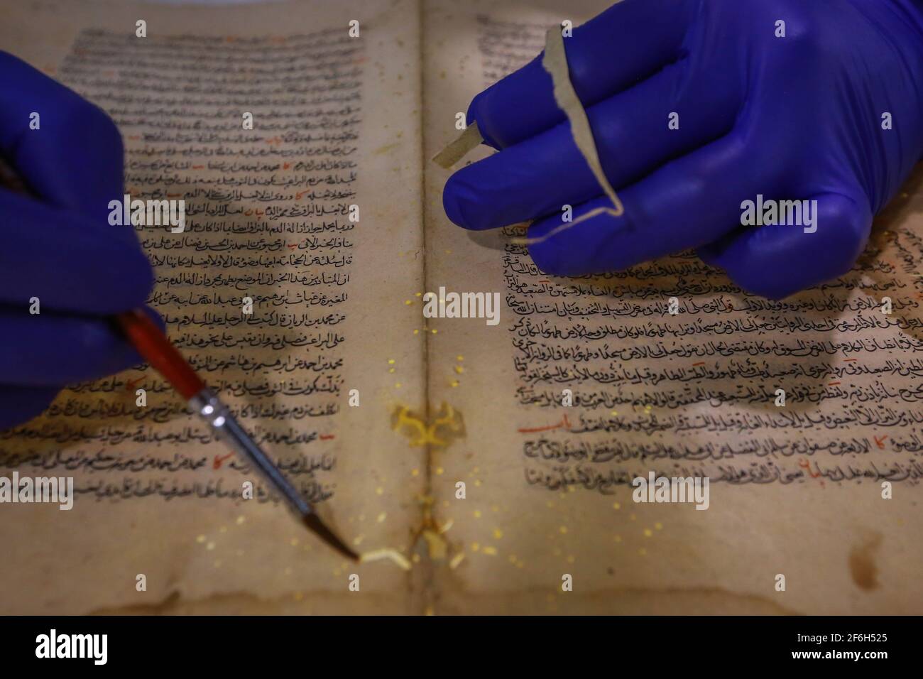 Najaf, Iraq. 22nd Mar, 2021. Restorer Mostafa Majed works on a ...