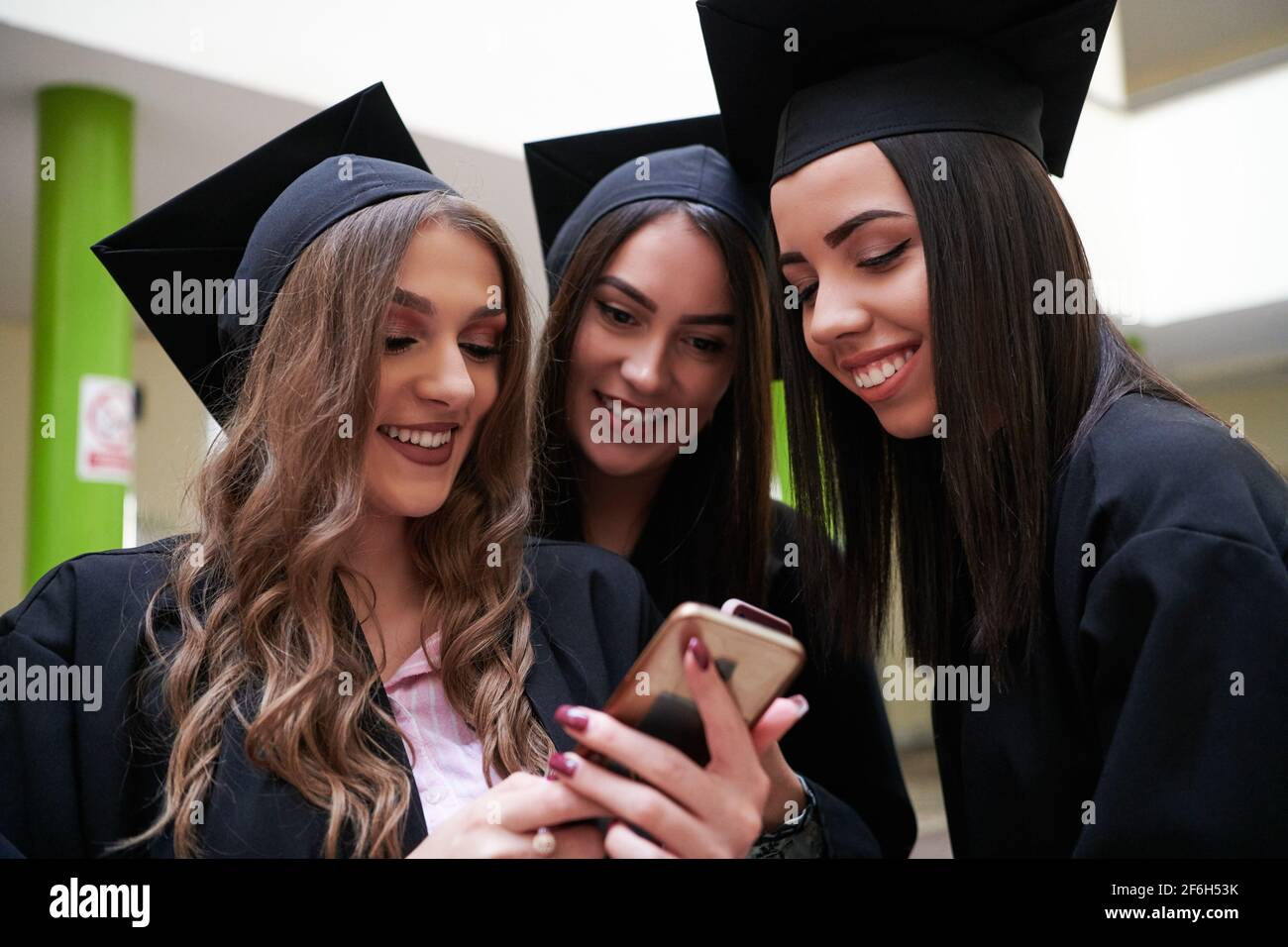 education, graduation, technology and people concept - group of happy ...