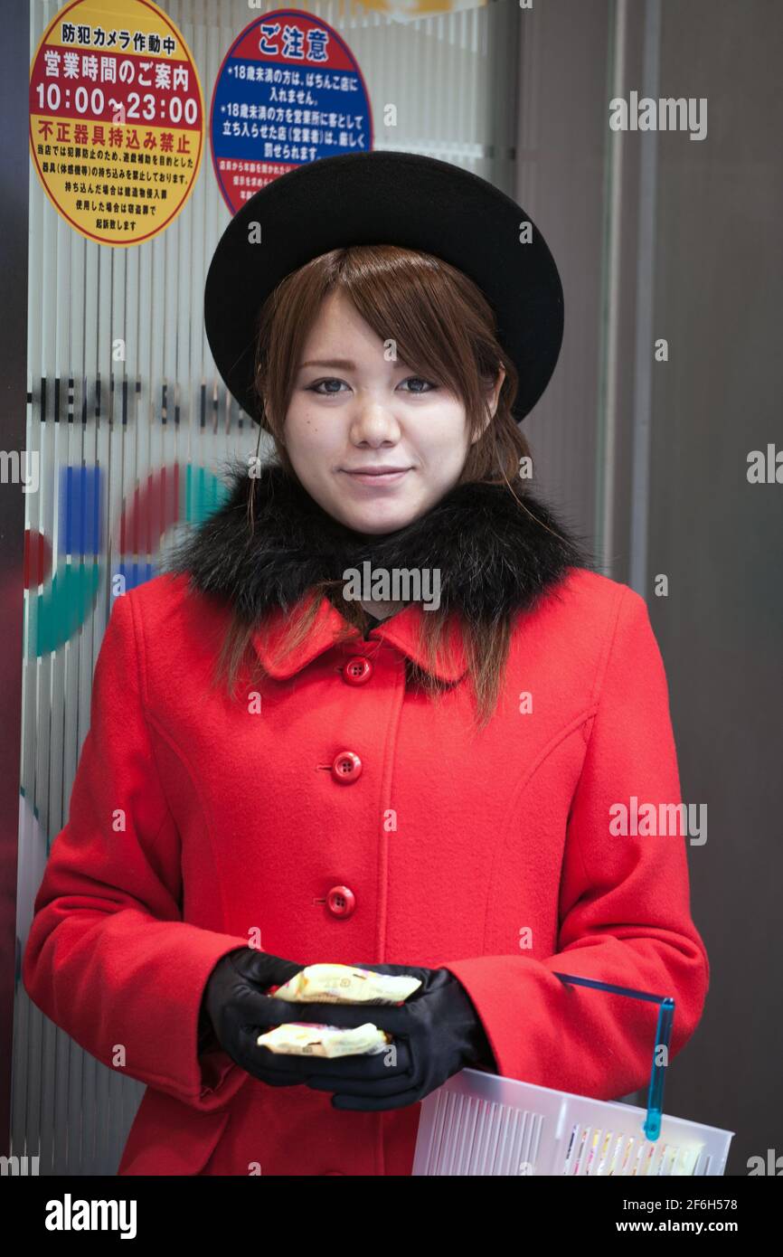 Woman handing out flyers hi-res stock photography and images - Alamy