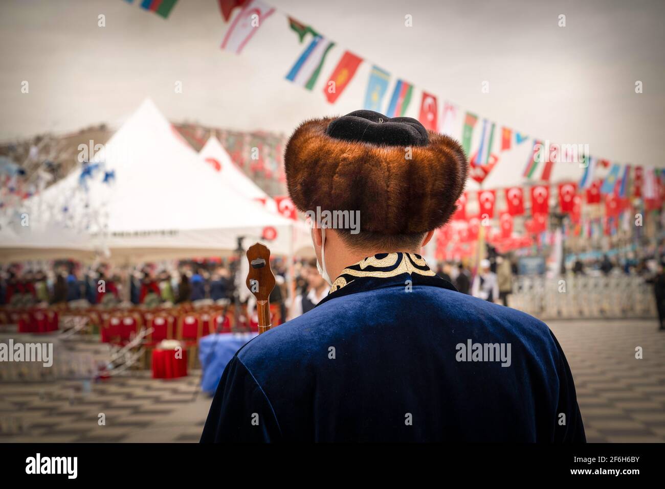 Back view of a central asian man with a cap Stock Photo - Alamy