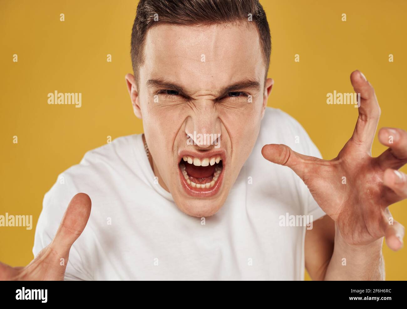 Aggressive man touches his head emotions model irritability Stock Photo ...