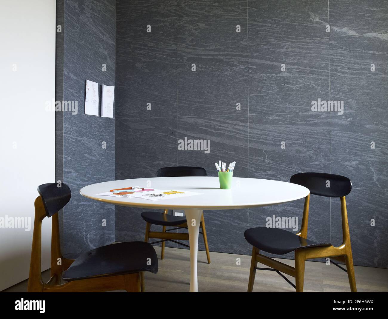 interior of modern kitchen with a table and chairs in front. Marker ...