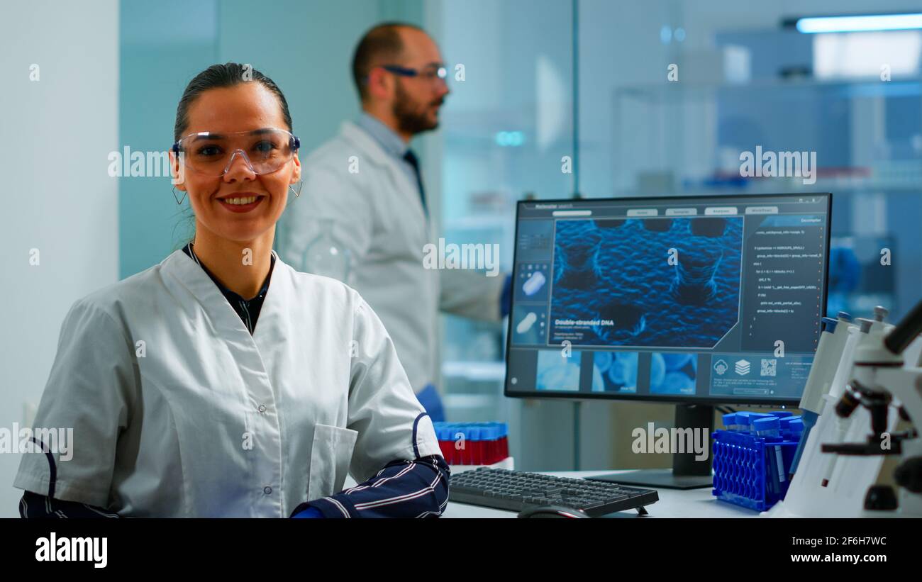 Laboratory doctor looking at camera smiling in modern equipped lab ...