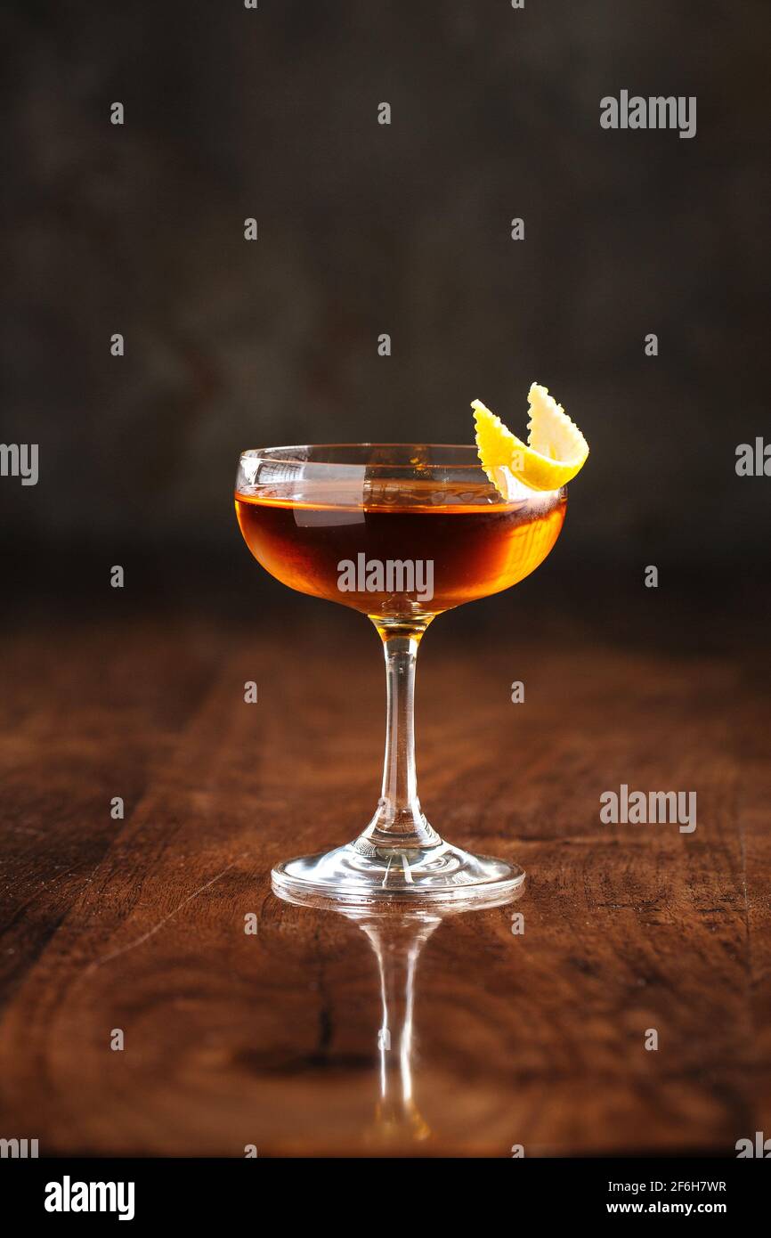 A glass of alcoholic cocktail with reflection Stock Photo - Alamy