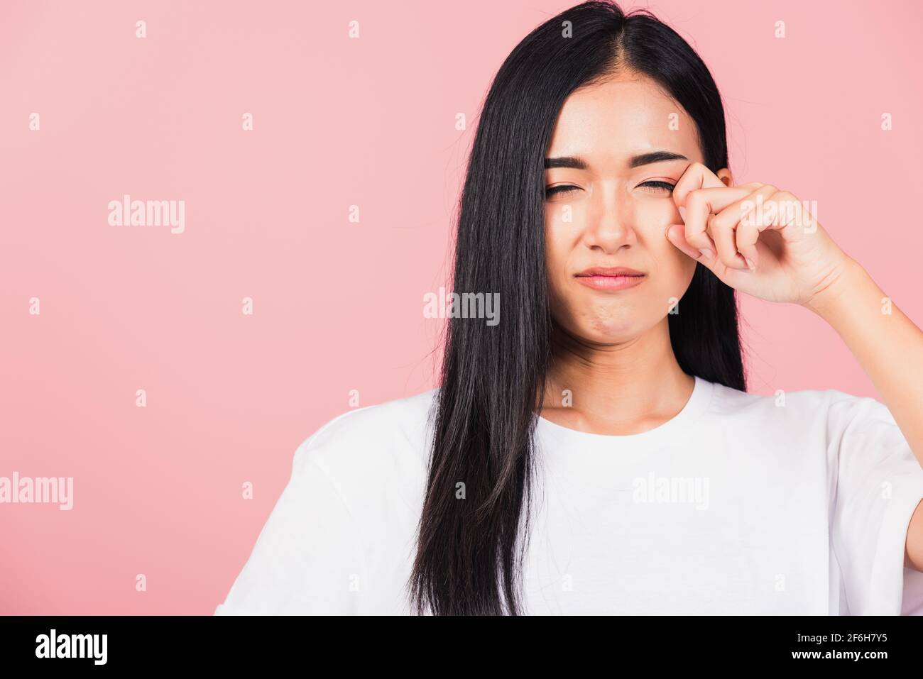Asian portrait beautiful cute young woman bad mood her cry wipe tears ...