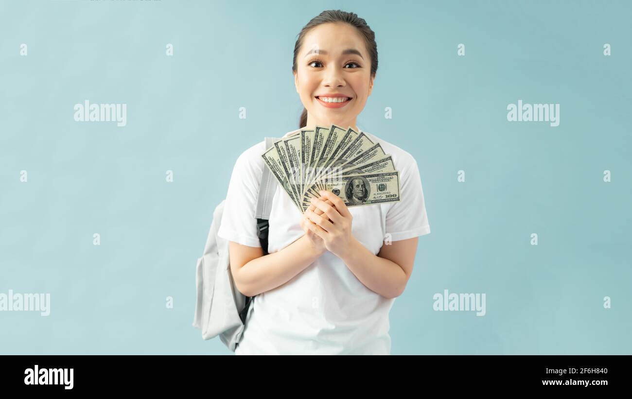 Shocked girl student in backpack isolated on pastel blue background ...
