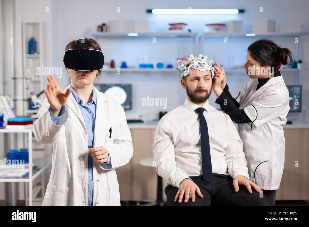 Neurologist researcher doctor adjusting hi-res stock photography and ...