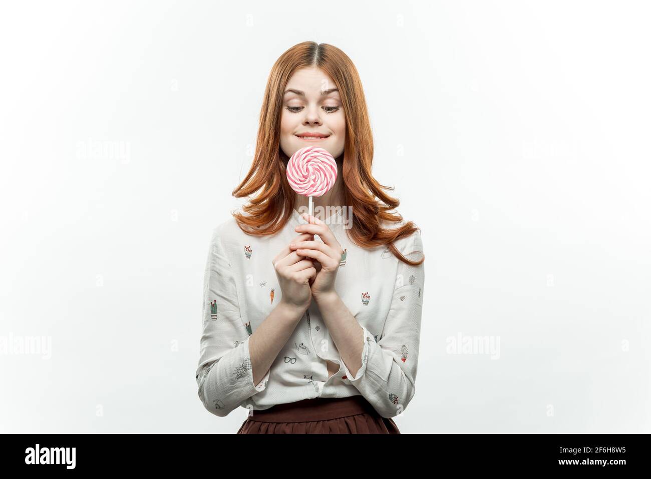 woman with lollipop in hands emotion charm sweets joy isolated ...