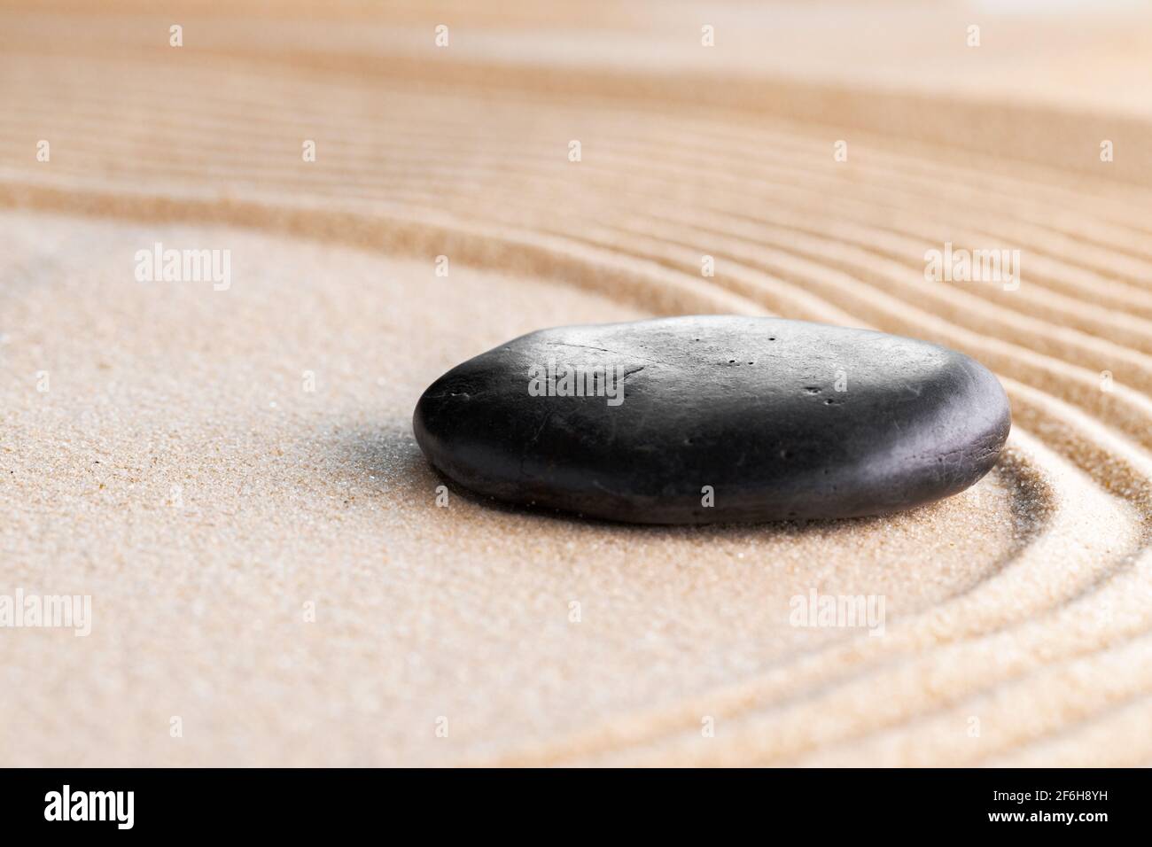 Japanese zen garden with stone in raked sand Stock Photo - Alamy
