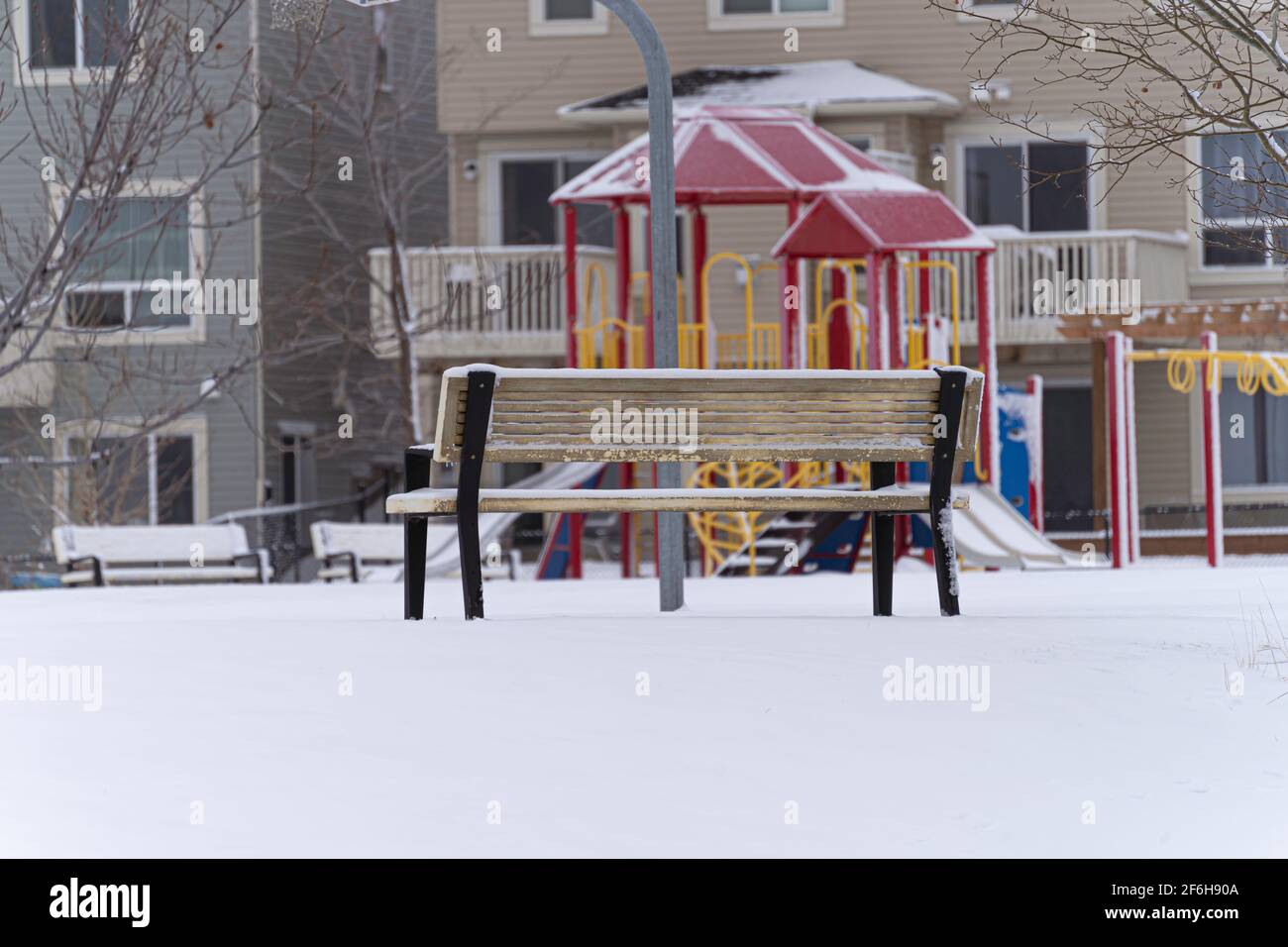 Park Bench in front of Childrens playground in public park Stock Photo ...