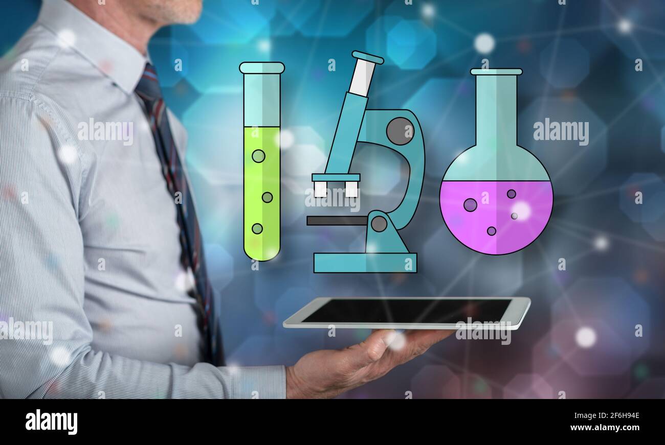 Biotechnology concept above a tablet held by a man Stock Photo - Alamy