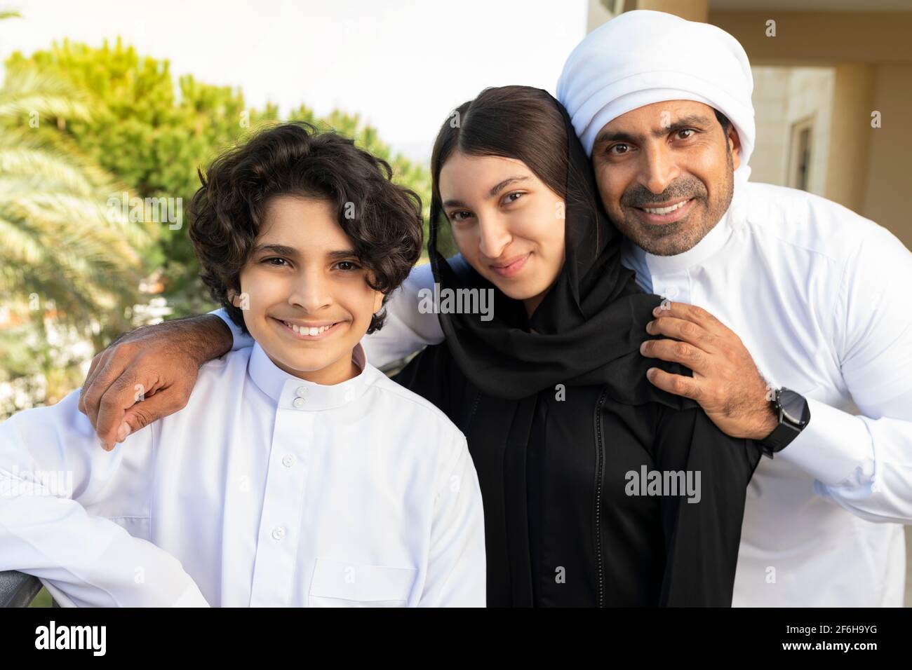 Arabian family of father, Brother, and daughter smiling Stock Photo - Alamy