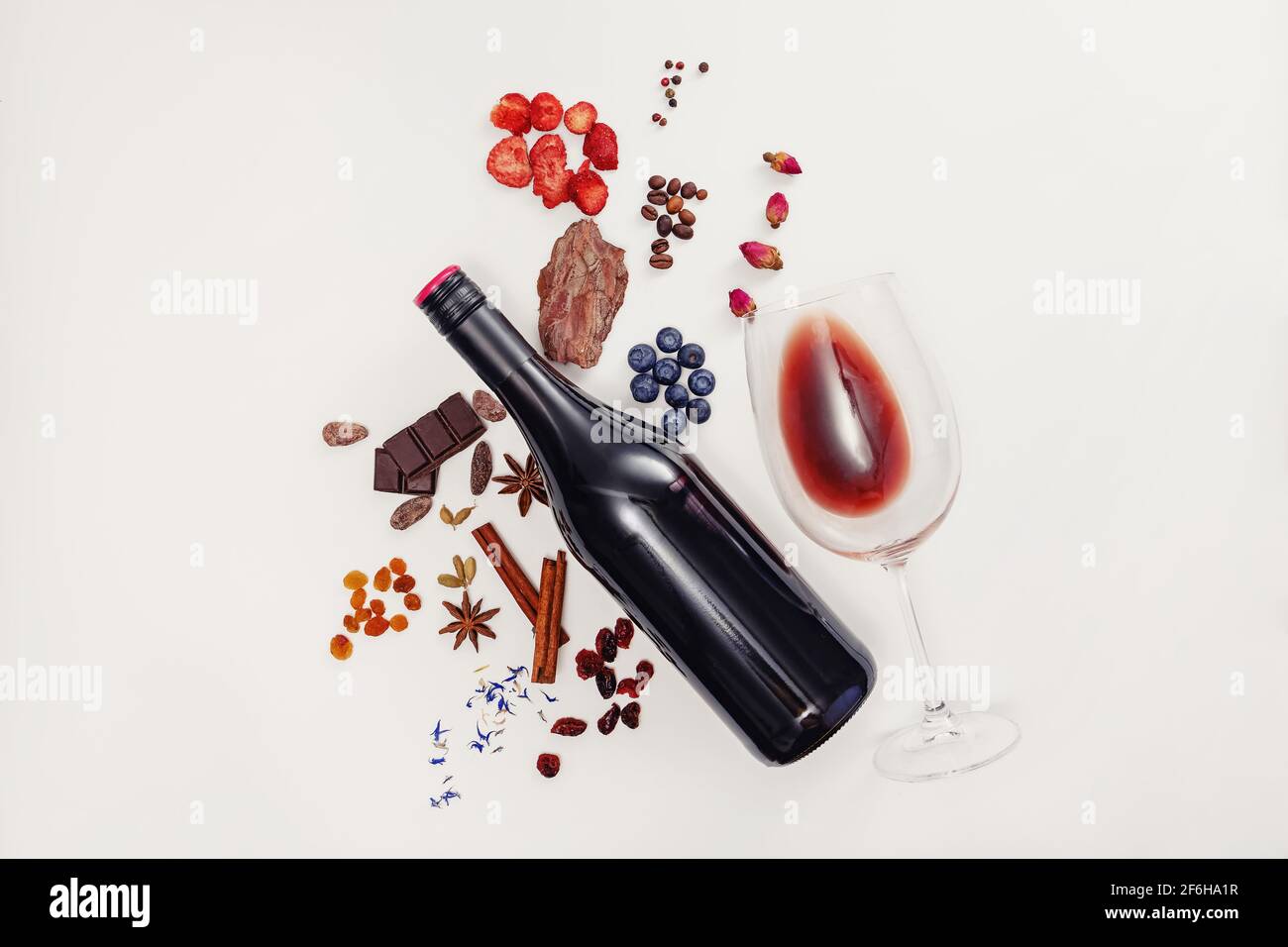 Composition with wine bottle, glass and possible flavor components of ...