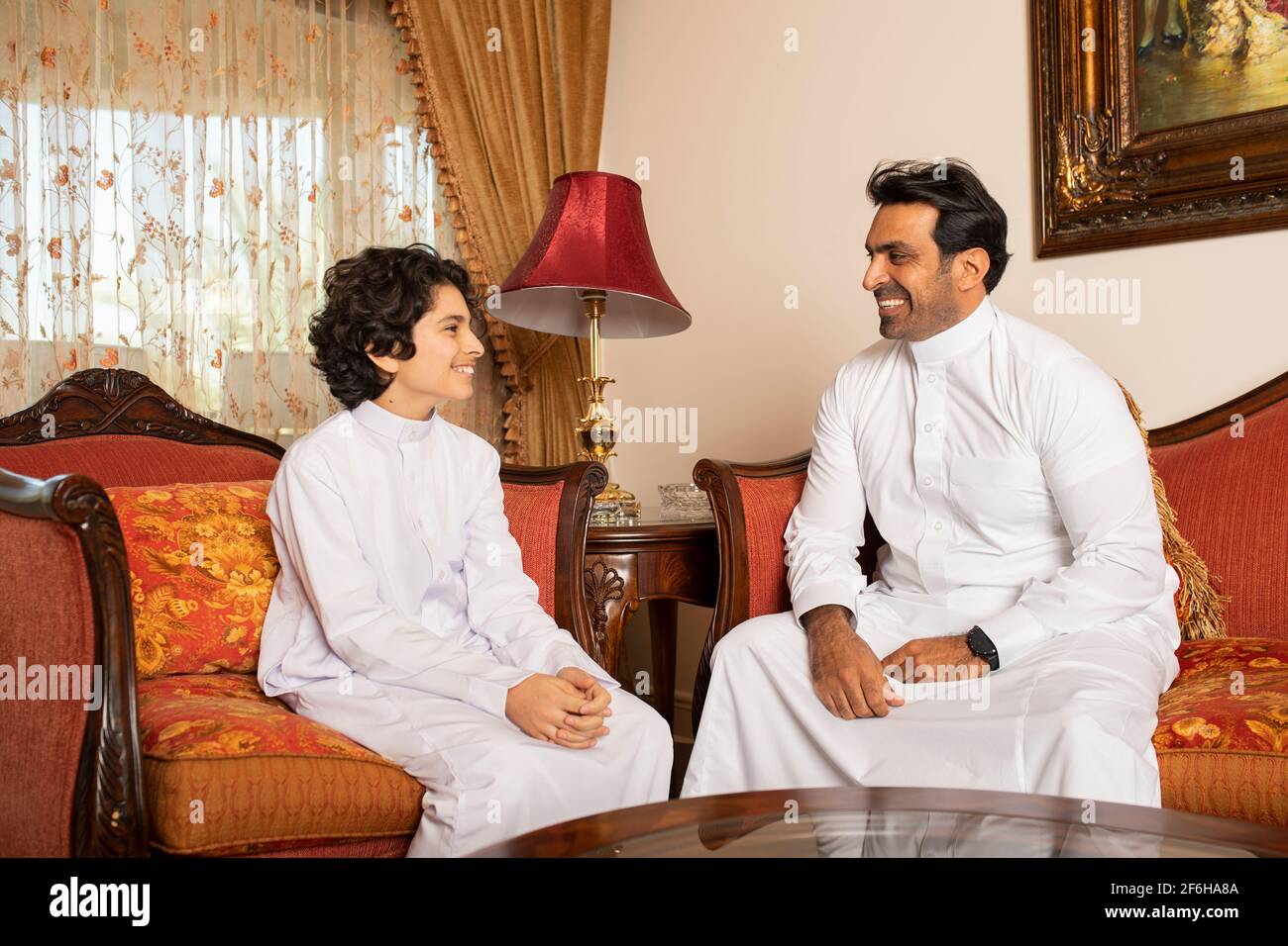 Arabian father and Son having a conversation Stock Photo - Alamy