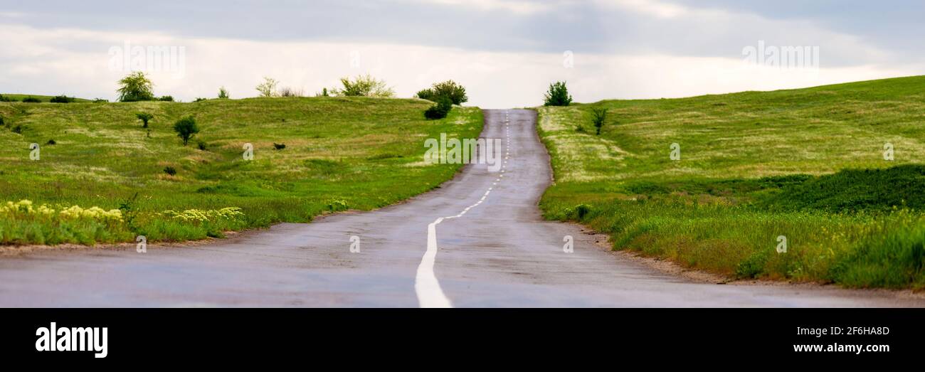 Empty old asphalt road with line in rural area Stock Photo - Alamy