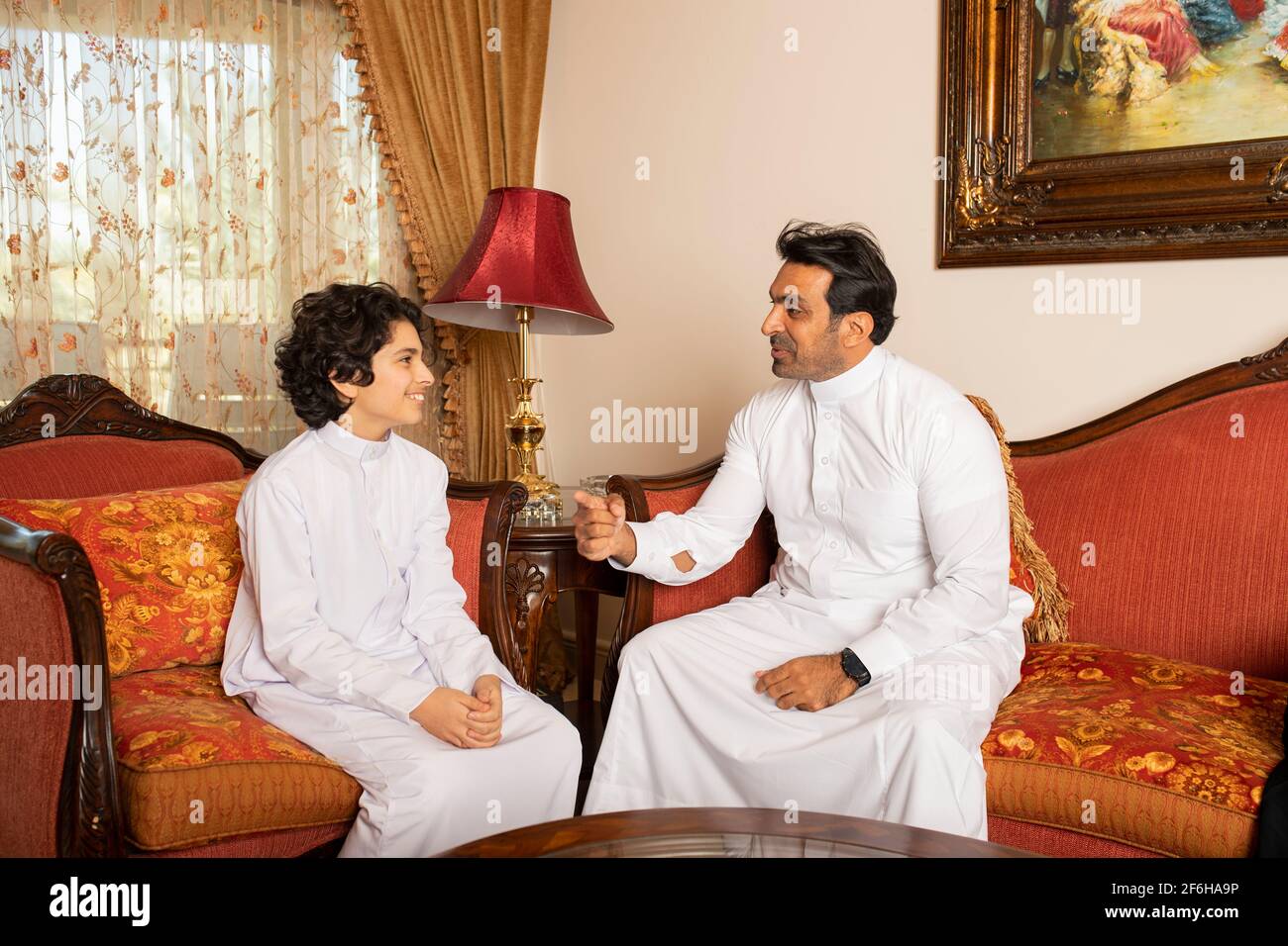Arabian father and Son having a conversation Stock Photo - Alamy