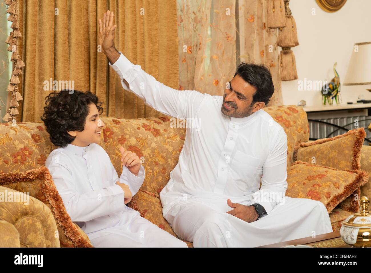 Arabian father and Son having a conversation Stock Photo - Alamy