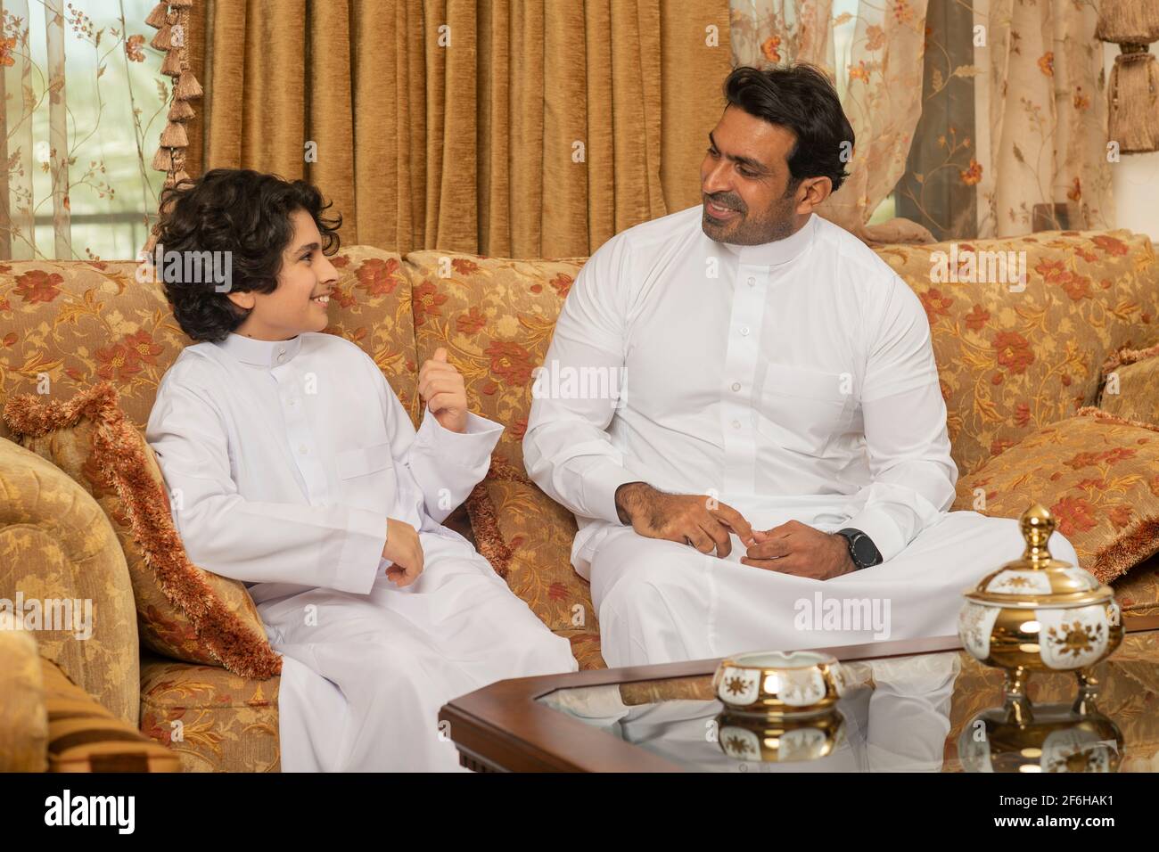 Arabian father and Son having a conversation Stock Photo - Alamy